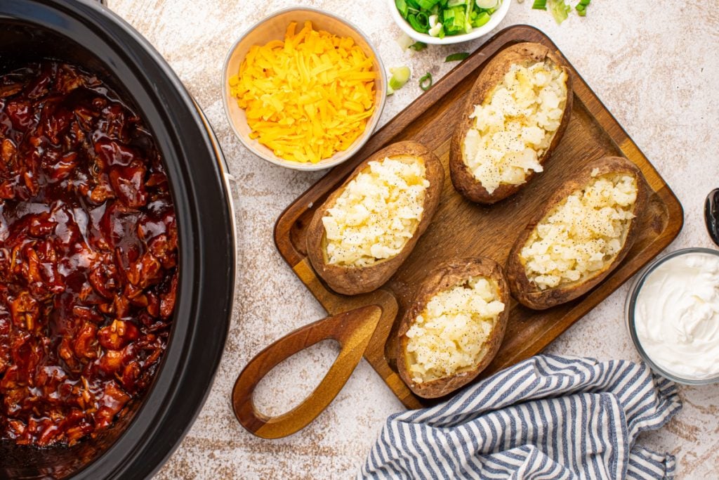 Slow Cooker BBQ Chicken Loaded Baked Potatoes - Family Fresh Meals